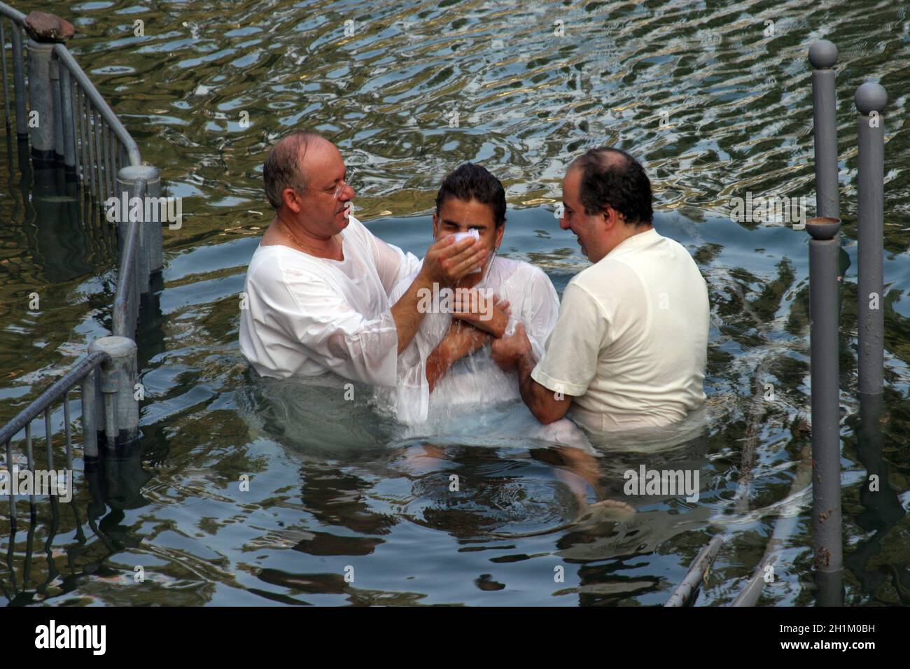Baptismal site at Jordan river shore. Baptism of pilgrims in Yardenit ...