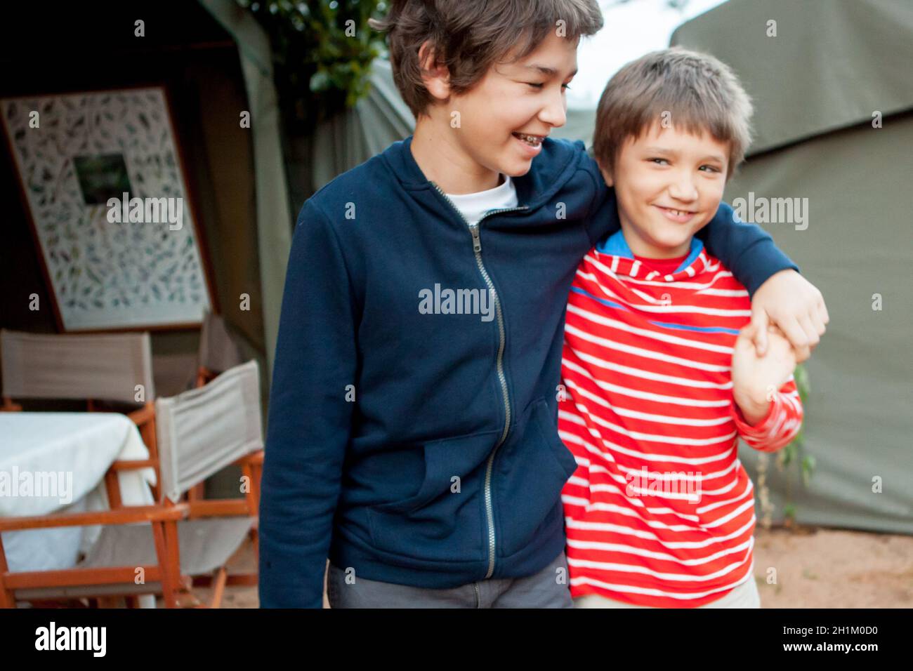 Young tween brothers laughing at safari camp Stock Photo - Alamy