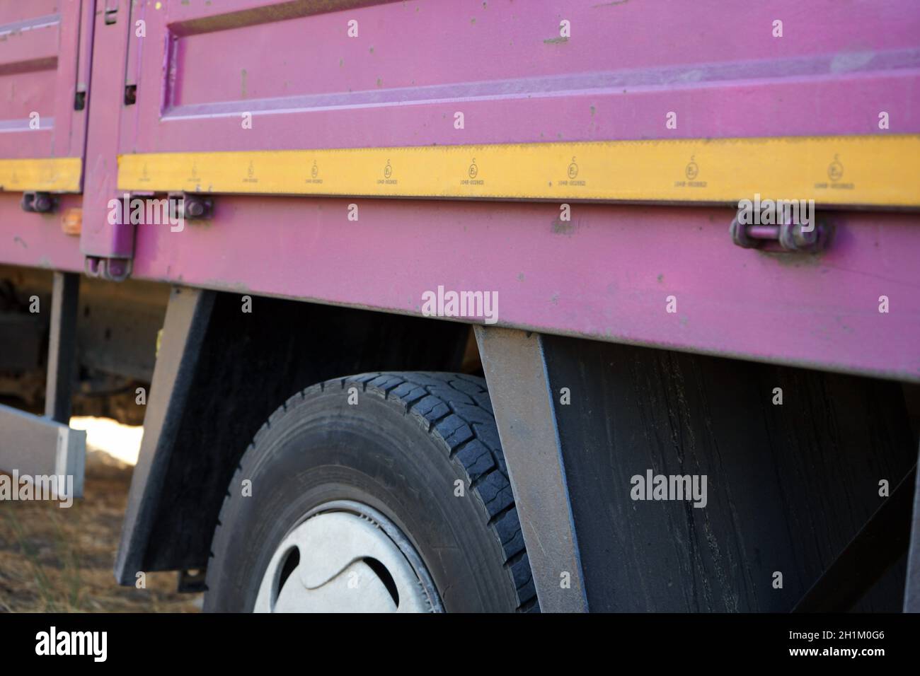 Close up of a wheel of a purple trunk Stock Photo - Alamy