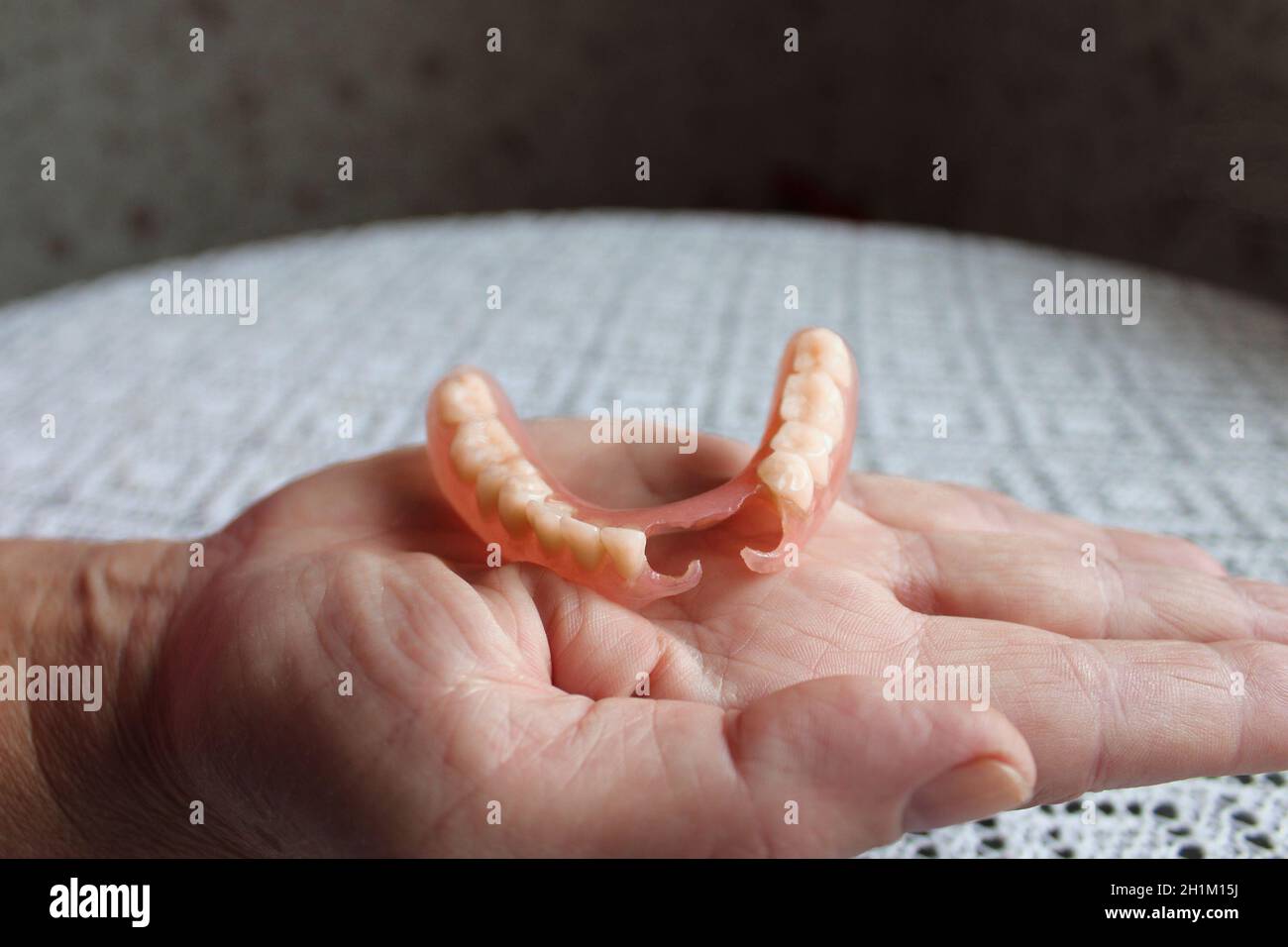 flexible nylon denture on male hand. Removable dentures flexible ...