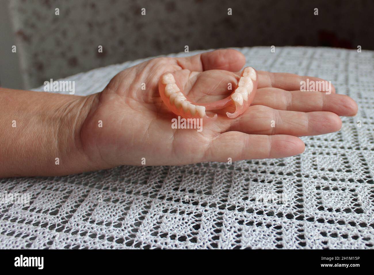 flexible nylon denture on male hand. Removable dentures flexible ...