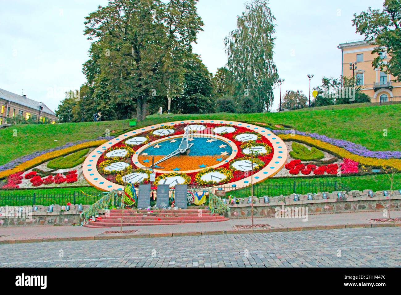 World's biggest flower watches in Kyiv. Beautiful flower clock on green ...