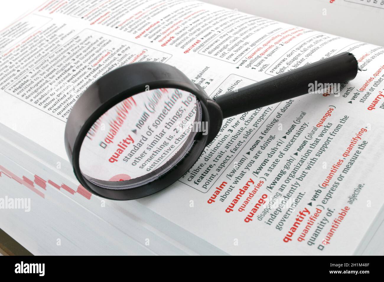 A magnifying glass focussed on the word quality. Quality assurance ...