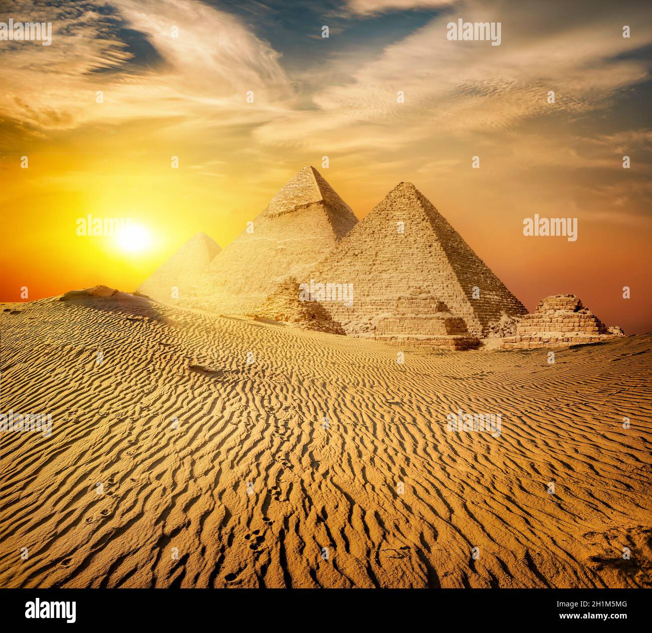 Egyptian pyramid in sand desert and clear sky Stock Photo - Alamy