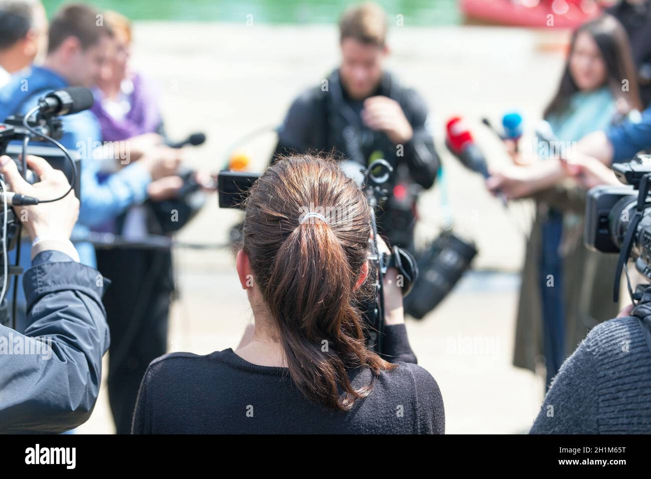 Filming media event with a video camera Stock Photo - Alamy