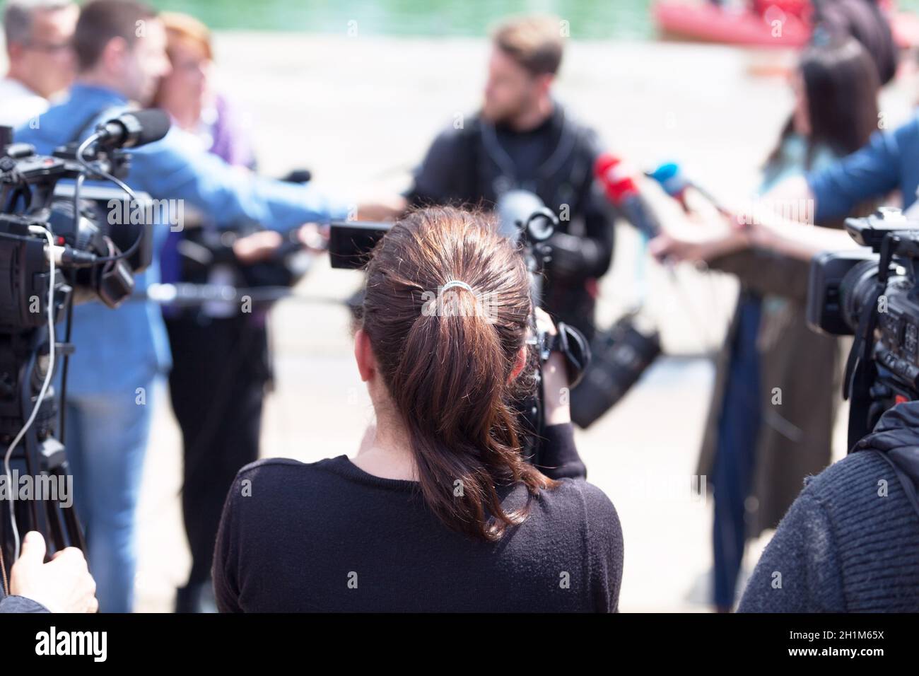 Filming media event with a video camera Stock Photo - Alamy