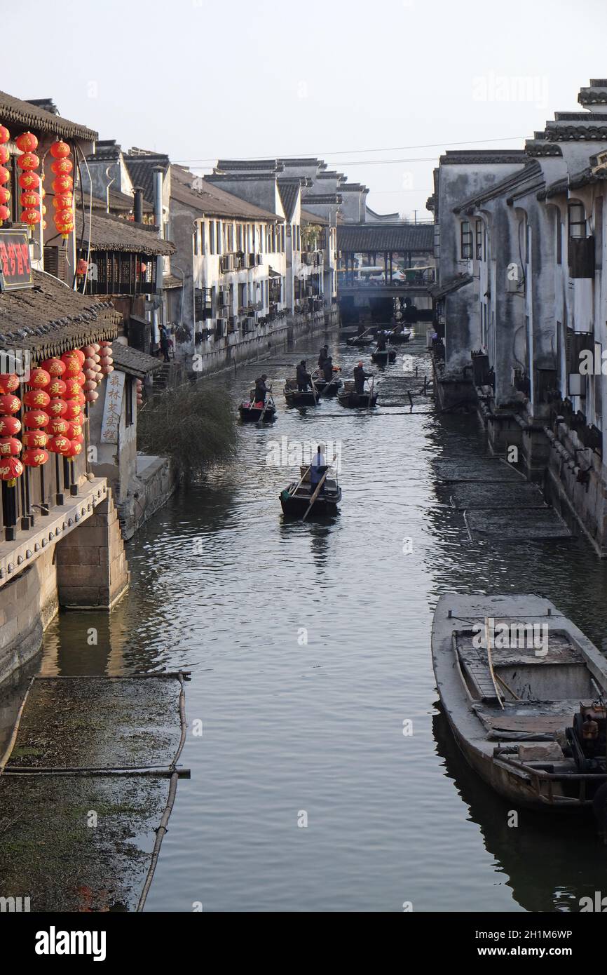 Tourist boats on the water canals of Xitang Town in Zhejiang Province ...