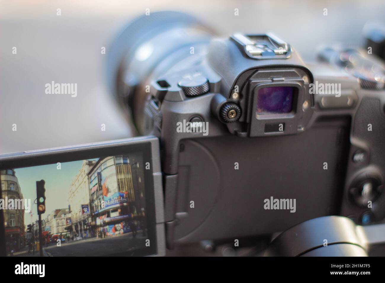 Digital camera up close recording classic white buildings from ...