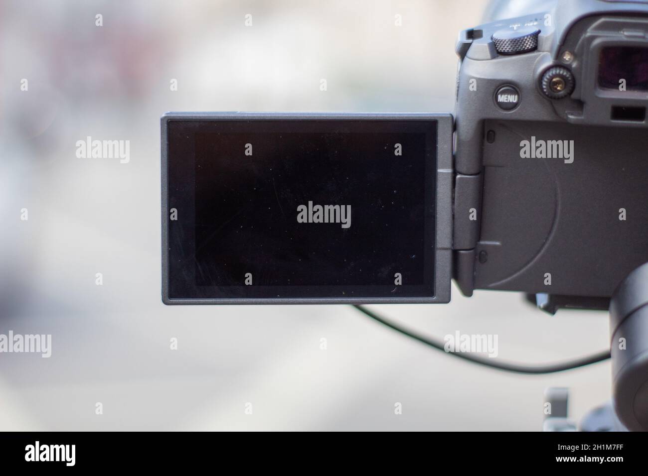 Black screen of digital camera with blurry street as background. Modern ...