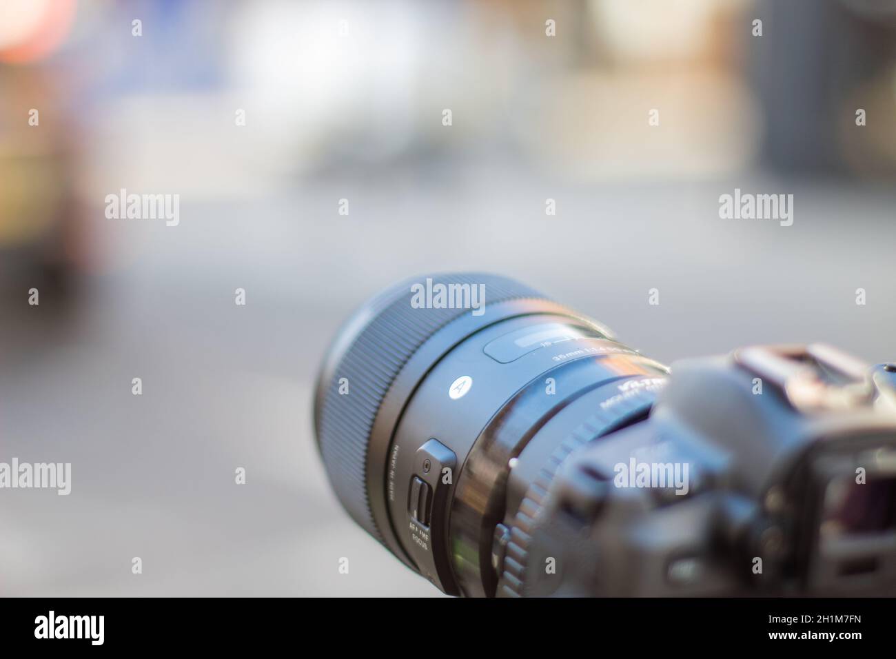 Digital camera up-close recording blurry traffic in street. Modern ...