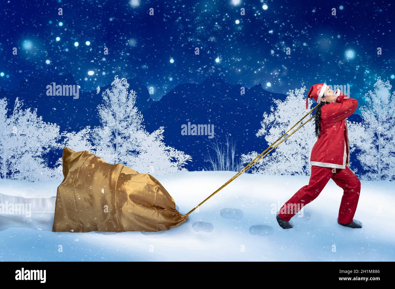 an elf in a green costume pulls a sack of presents behind her in a ...