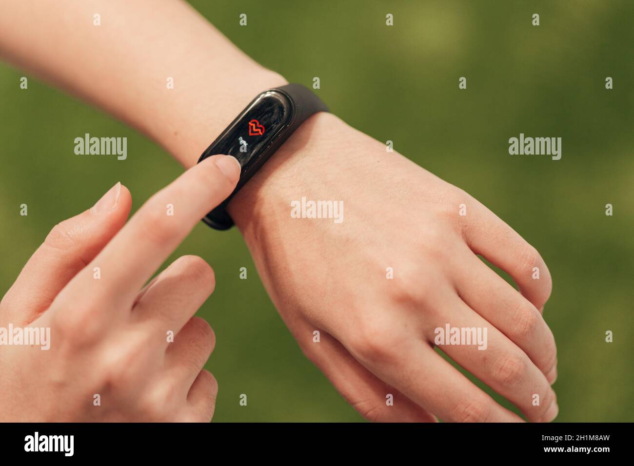 The smartwatch on the wrist measures the heartbeat. Pulse check Stock ...