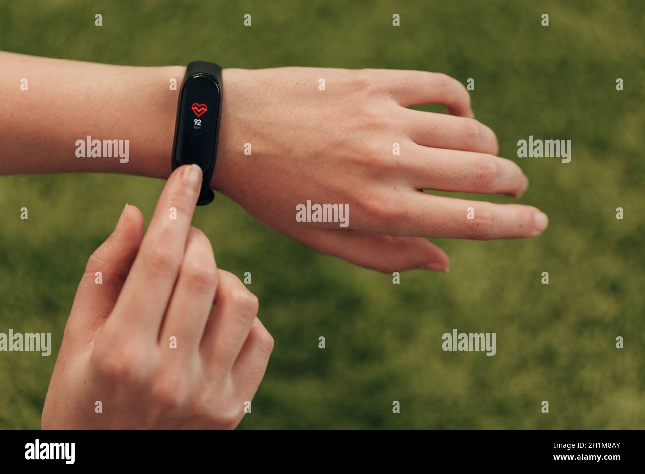 The smartwatch on the wrist measures the heartbeat. Pulse check Stock ...