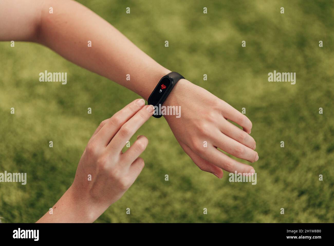 The smartwatch on the wrist measures the heartbeat. Pulse check Stock ...