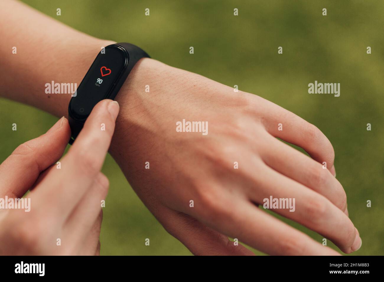 The smartwatch on the wrist measures the heartbeat. Pulse check Stock ...