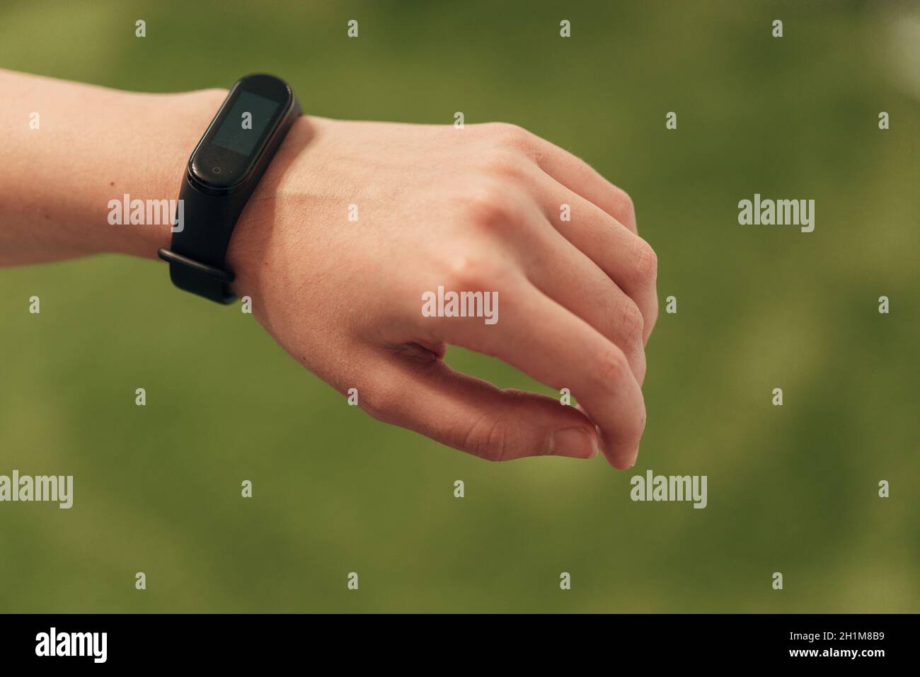 The smartwatch on the wrist measures the heartbeat. Pulse check Stock ...