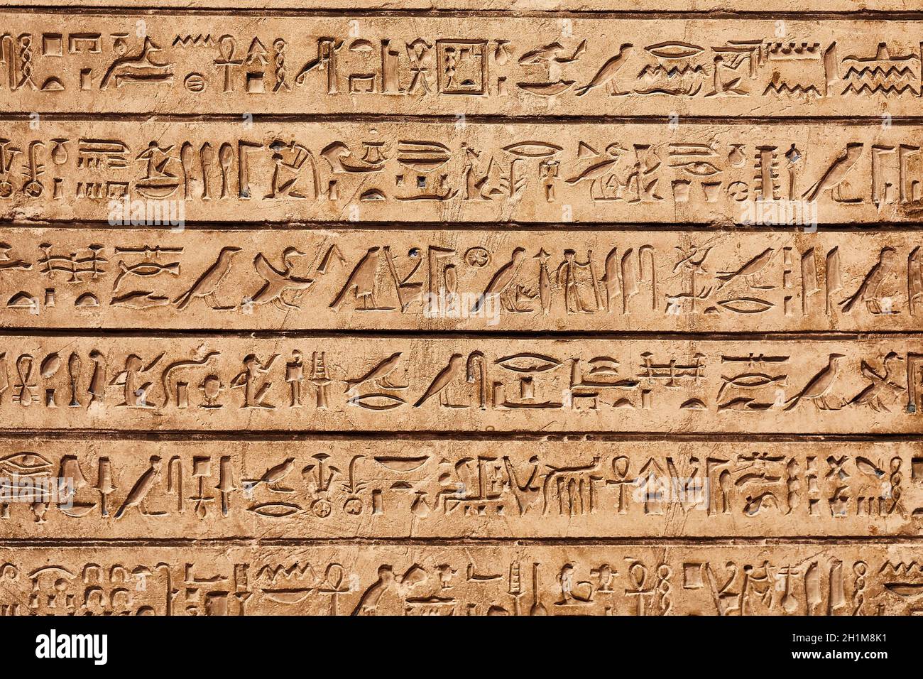 Egyptian hieroglyphs carved in sandstone Stock Photo - Alamy