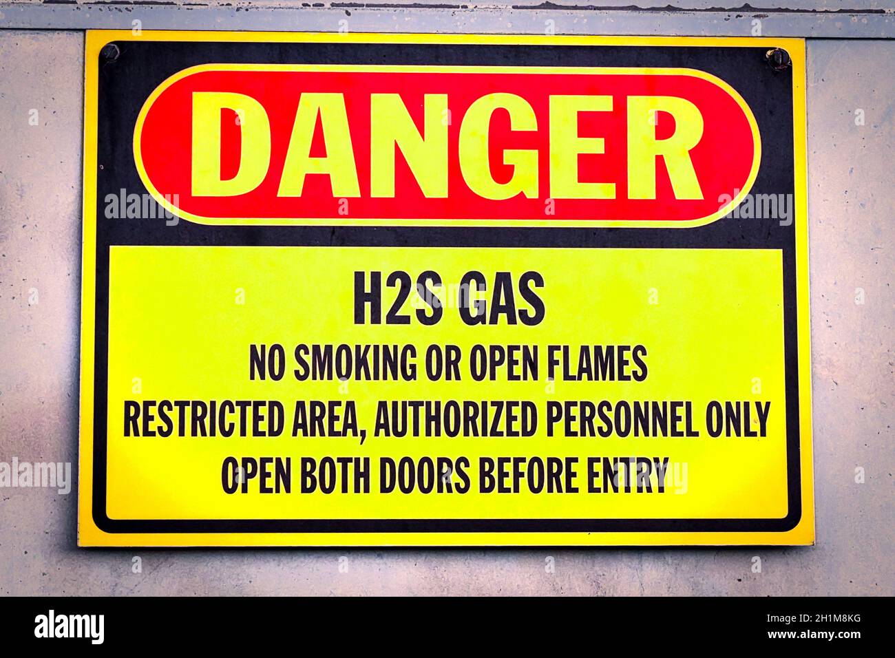 Closeup of a yellow Danger H2S Gas sign Stock Photo - Alamy