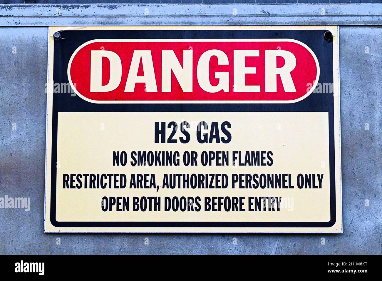 Closeup of a white Danger H2S Gas sign Stock Photo - Alamy