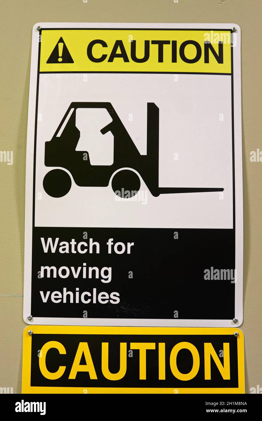 A Caution Watch for Moving Vehicles sign Stock Photo - Alamy
