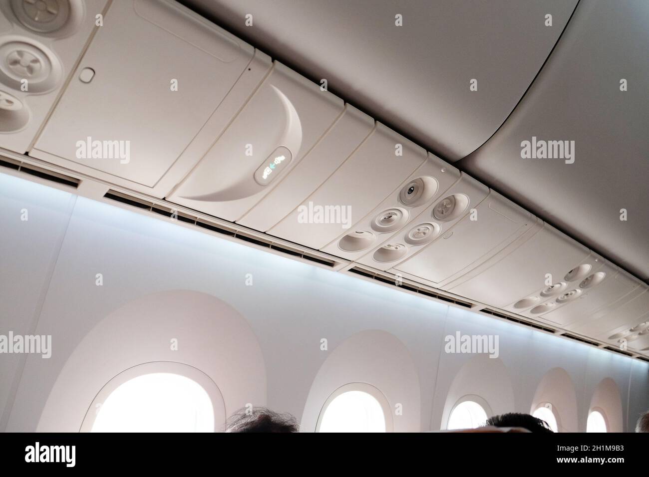 Overhead locker airplane hi-res stock photography and images - Alamy