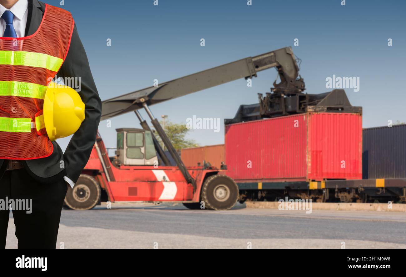 Businessman stand on front forklift loading Containers box to Logistic ...