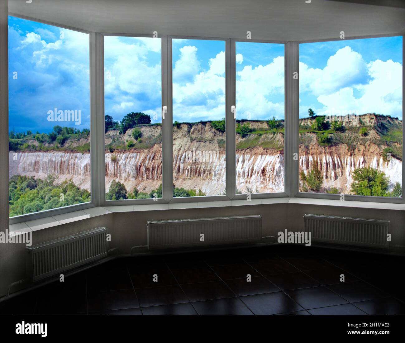 modern window of veranda overlooking high sandy cliff. Beautiful ...