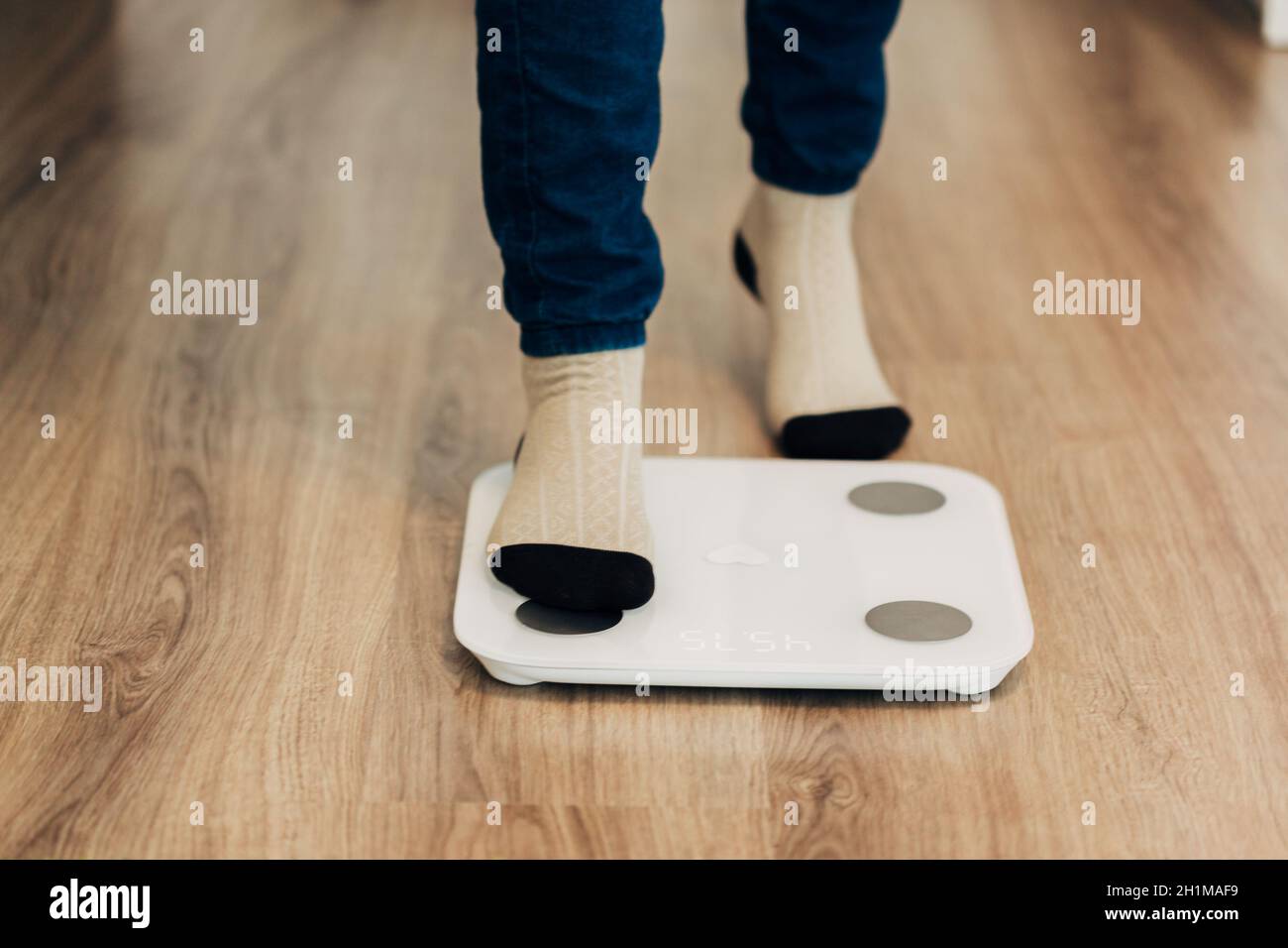 Modern Electronic Device. Girl Measures Weight on Smart Scales Stock ...