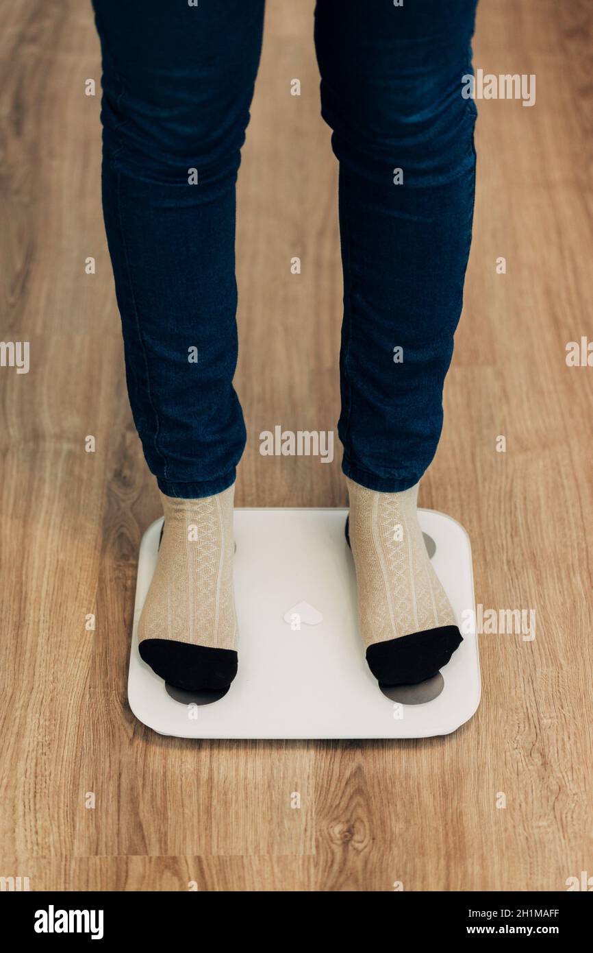 Modern Electronic Device. Girl Measures Weight on Smart Scales Stock ...