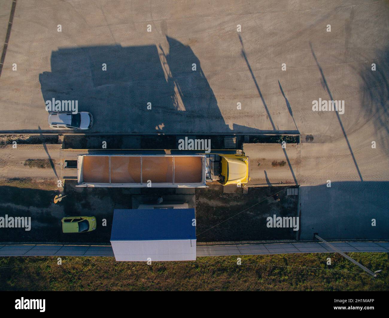 Unloading of Corn Grain in the Warehouse. Aerial View Over The Truck ...