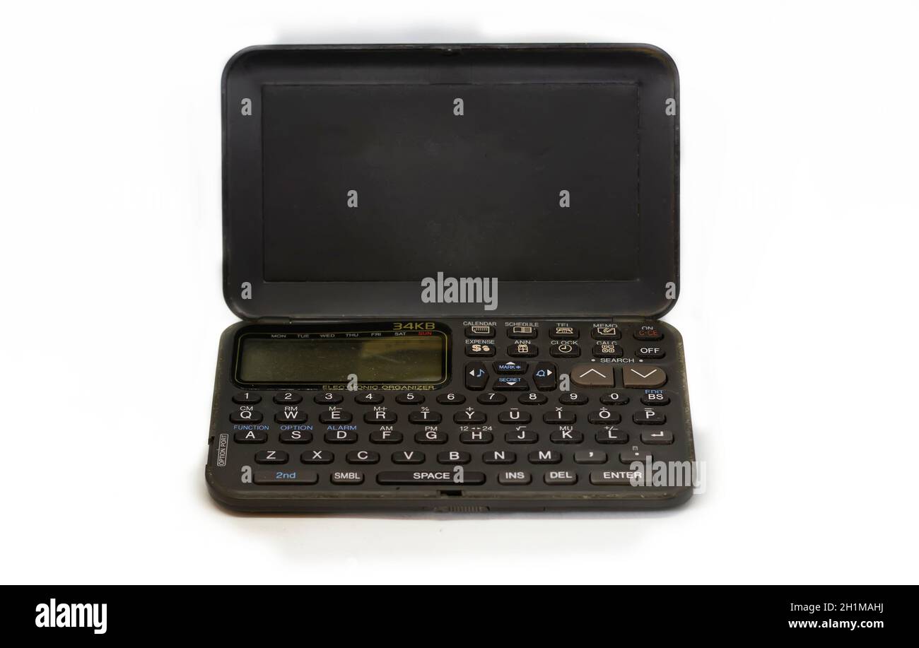 Old electronic organizer with liquid crystal display with the flap open ...
