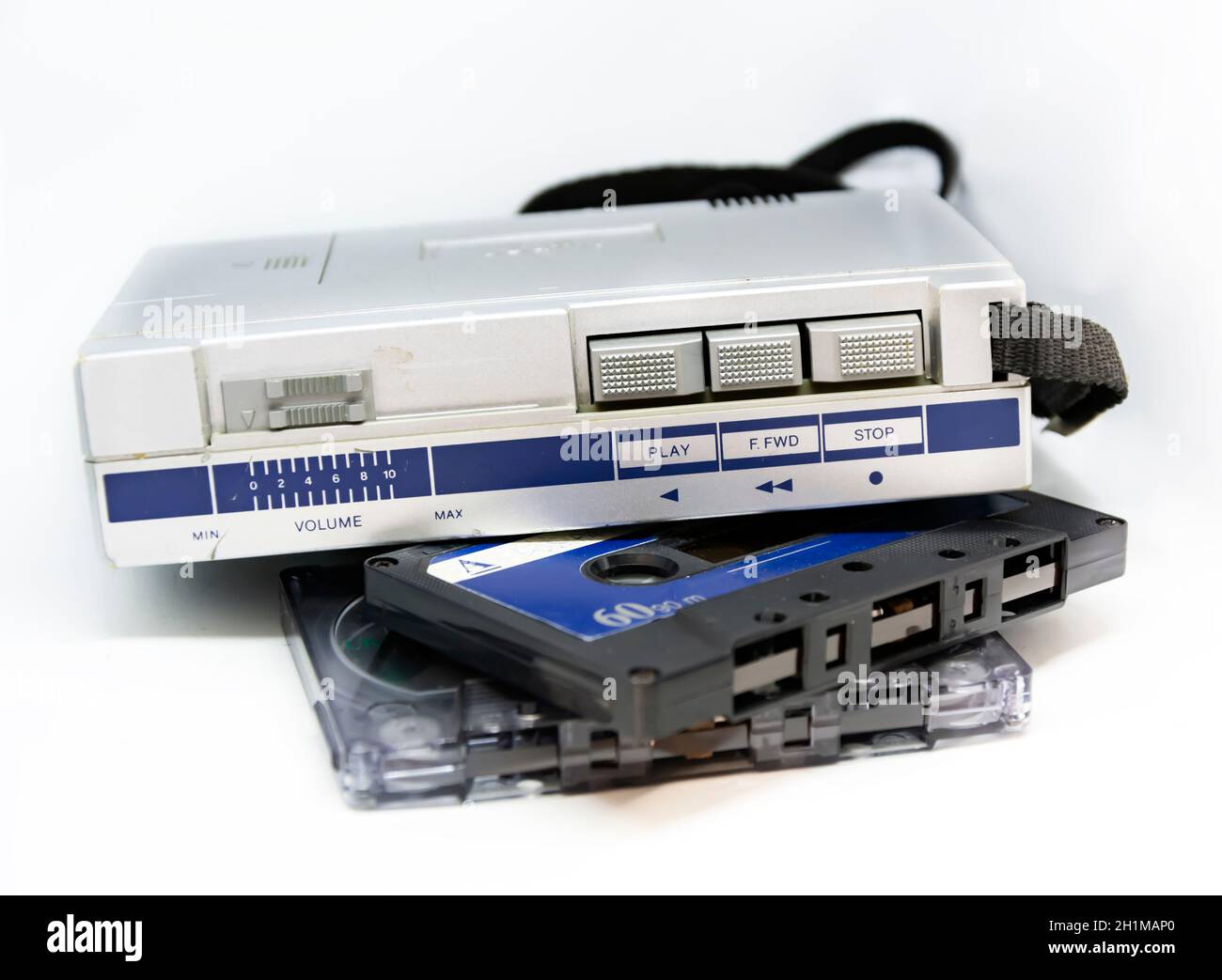 Old portable stereo audio tape cassette player isolated on a white ...