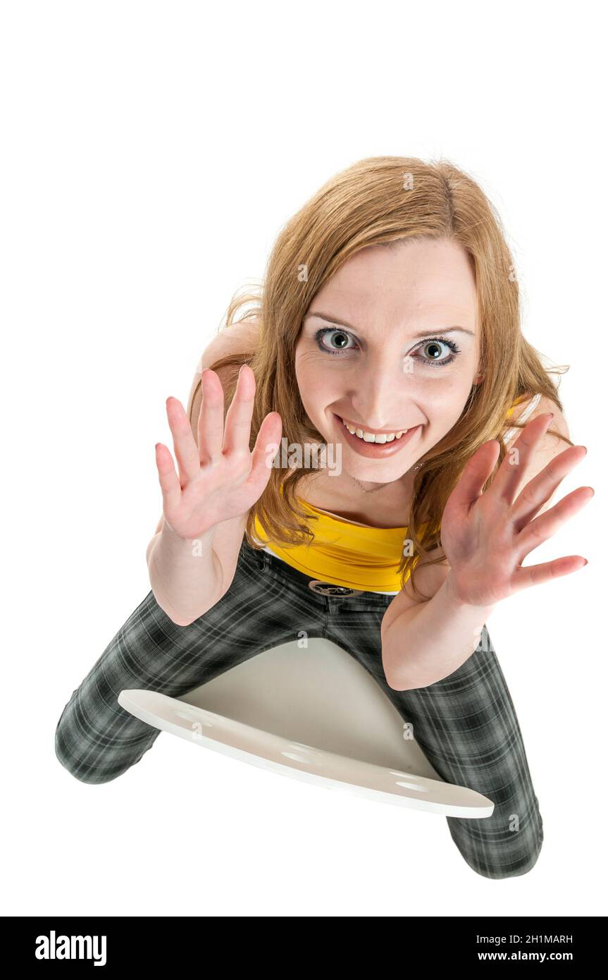 Wide angle extremely high full length view of a young blonde woman ...