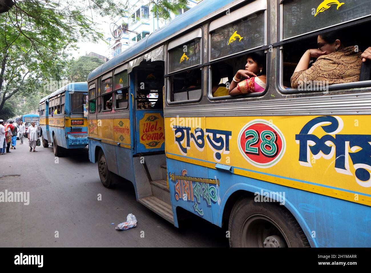 People on the move come in the colorful bus in Kolkata, India Stock ...