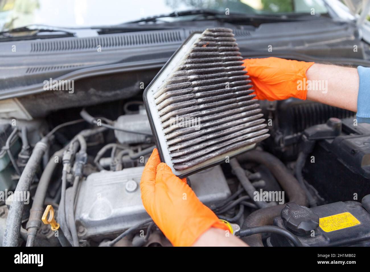 Dirty car engine air filter Stock Photo - Alamy