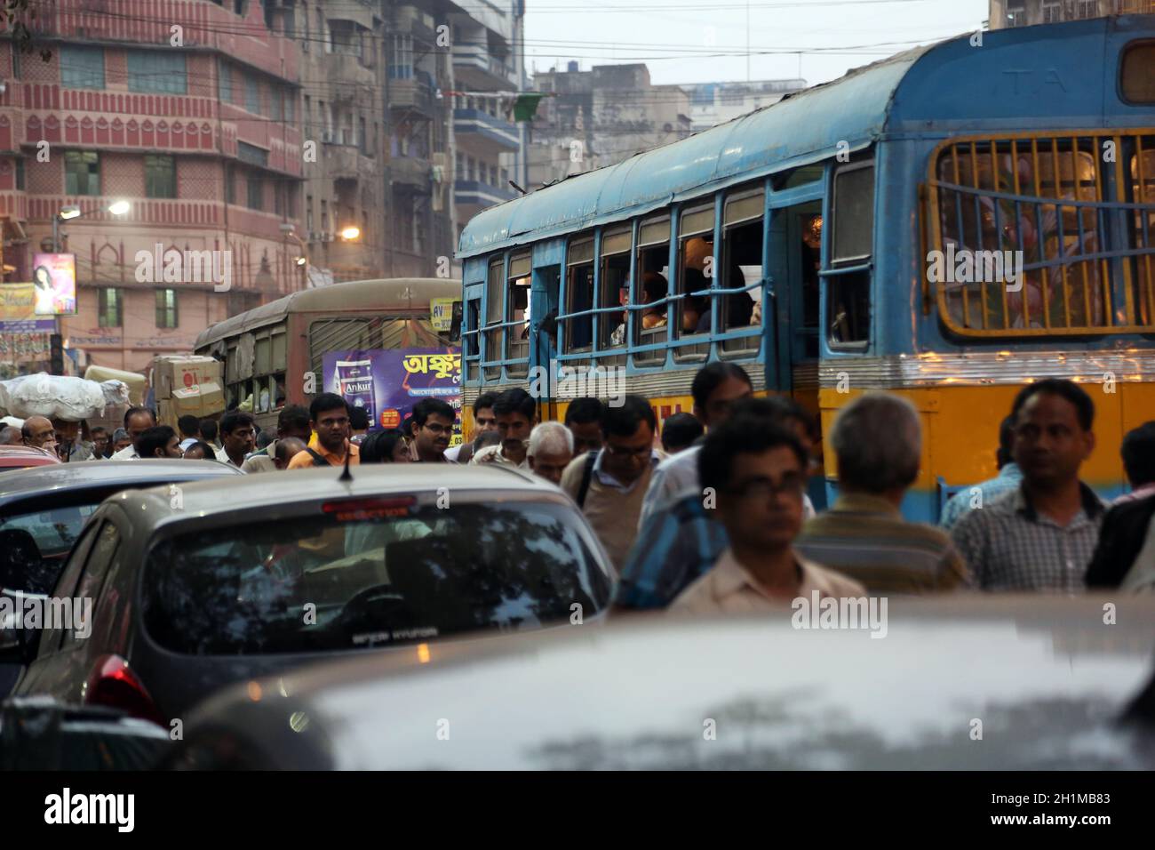 Dark city traffic blurred in motion at late evening on crowded streets ...