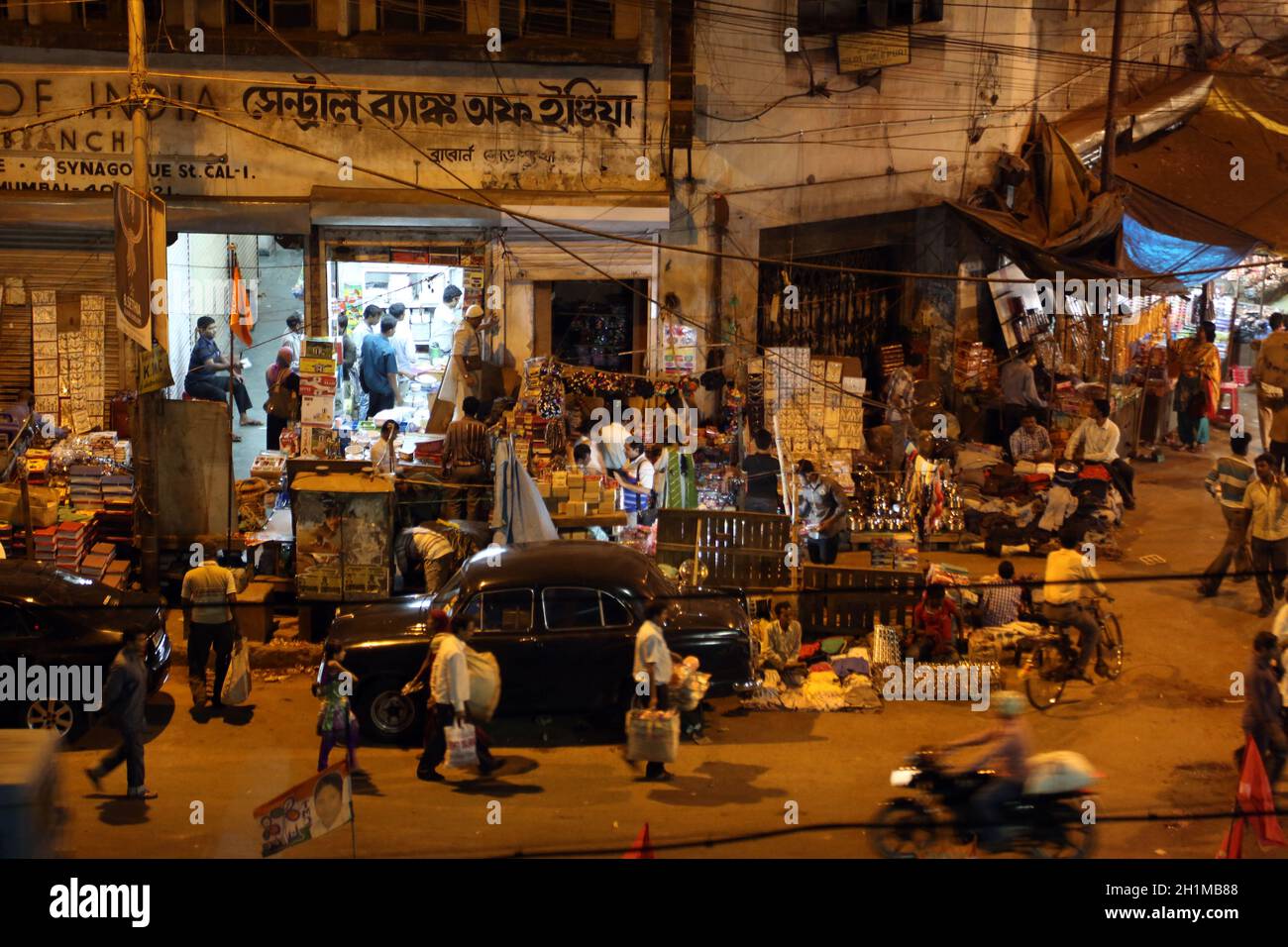 Dark city traffic blurred in motion at late evening on crowded streets ...