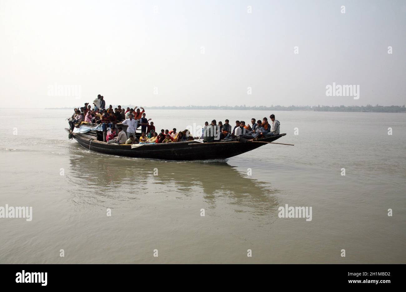 Wooden boat crosses the River in Sundarbans, West Bengal, India Stock ...