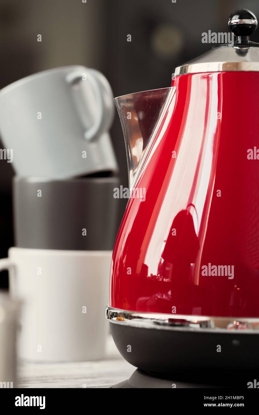 Vintage style red electrical teapot in kitchen interior Stock Photo - Alamy