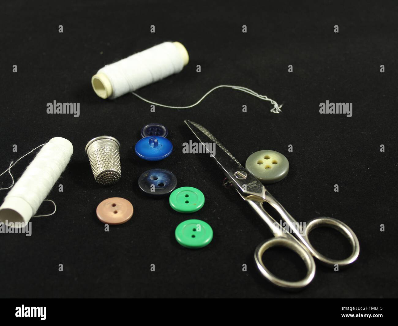 Sewing Needle thread scissors thimble tailor buttons Stock Photo - Alamy