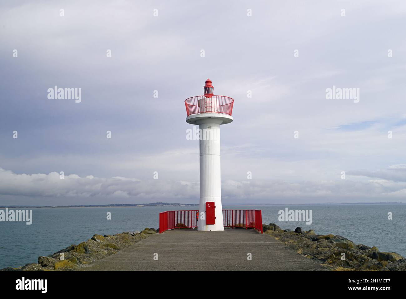 The lighthouse guards the entrance to the port of Howth Stock Photo - Alamy