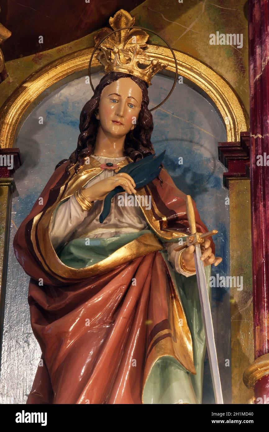 Saint Catherine of Alexandria statue on the main altar in the Church of ...