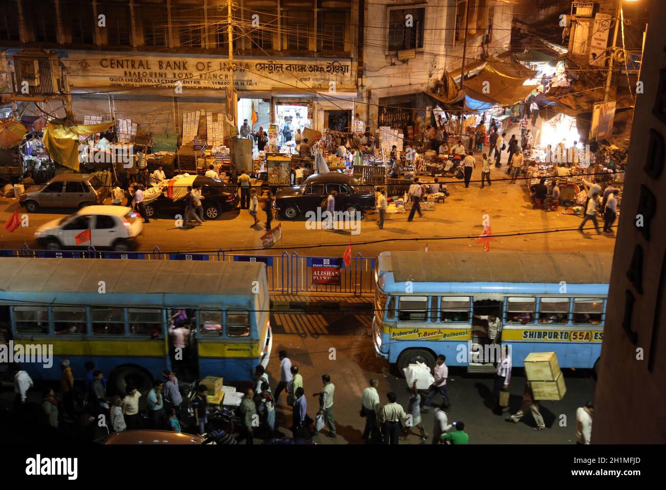 Dark city traffic blurred in motion at late evening on crowded streets ...