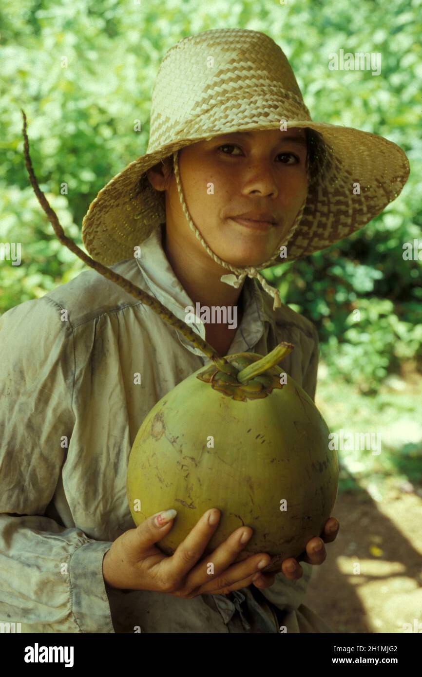 a women with a coconut near the City of Siem Reap in the west of ...