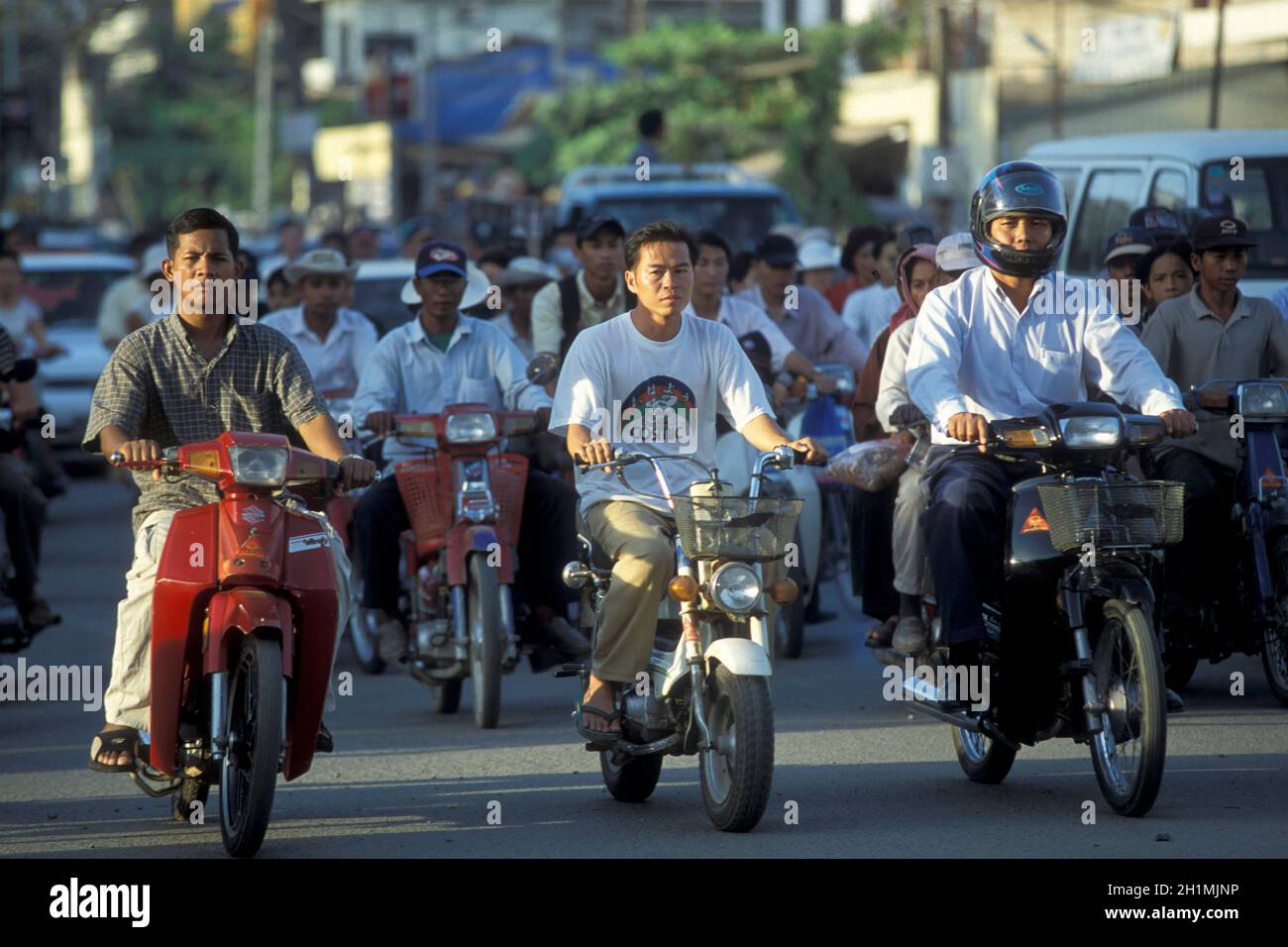 Motorbike on a road in the city of Phnom Penh of Cambodia. Cambodia, Phnom Penh, February, 2001 ...