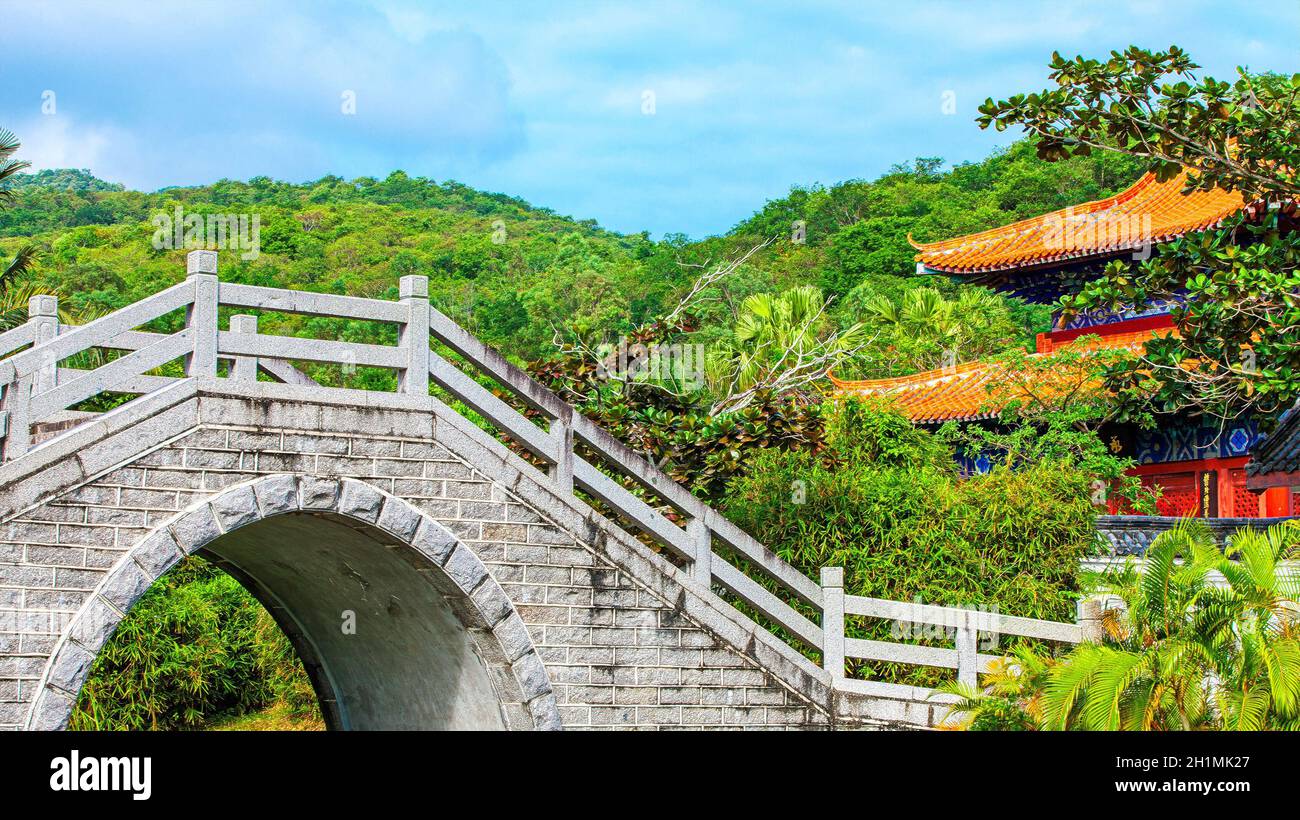 The Chinese garden with bridge and pond around the building Stock Photo ...