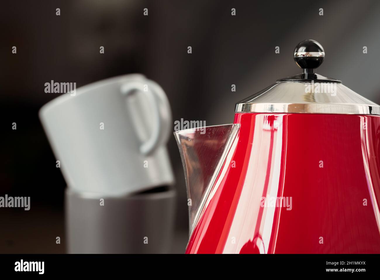 Vintage style red electrical teapot in kitchen interior Stock Photo - Alamy