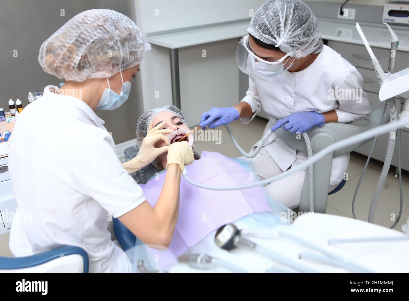 Young girl patient in dental office. Professional oral hygiene and ...