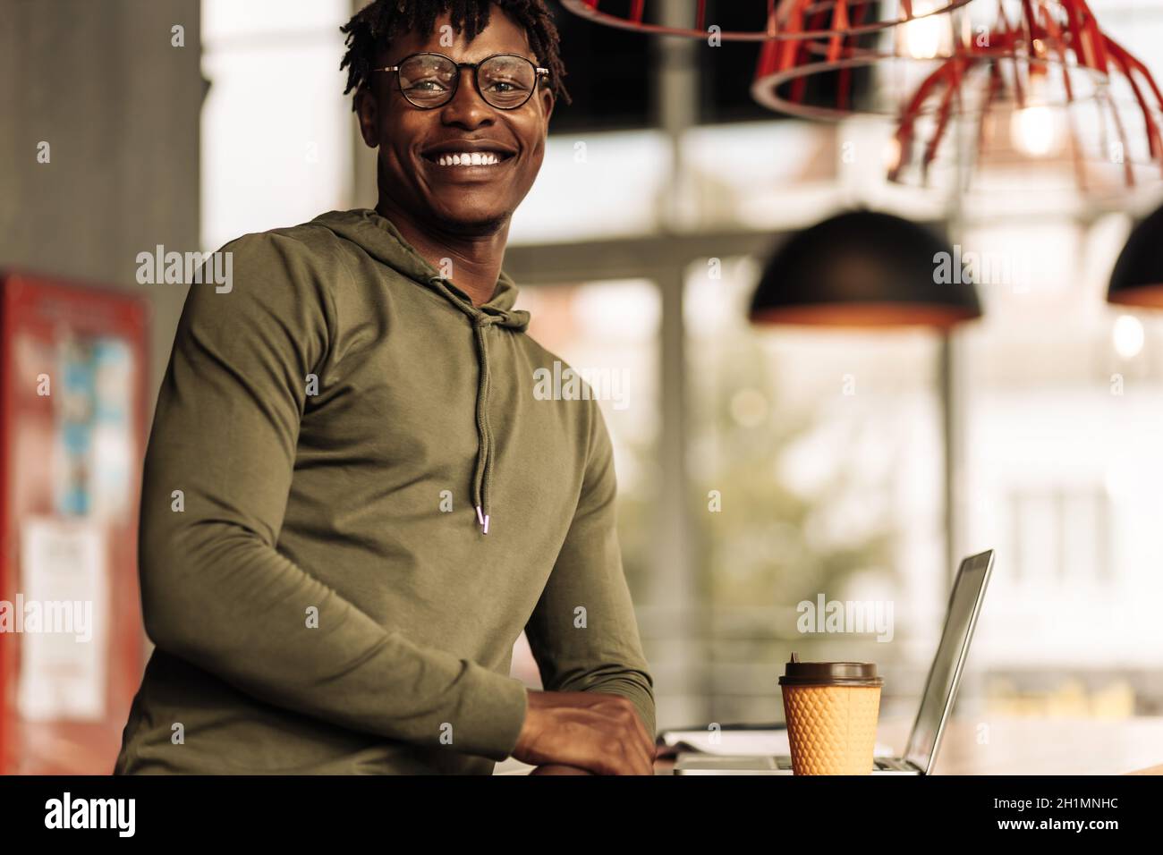 portrait in office African man standing against the background of the ...