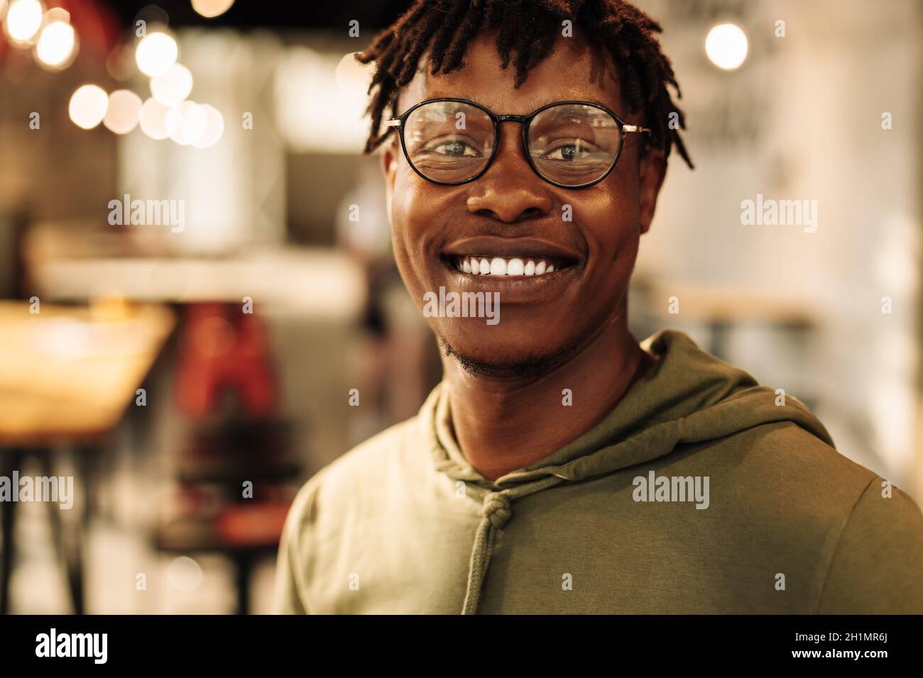portrait in office African man standing against the background of the ...